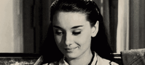 Smiling Woman's Expressive Reaction GIF - Share & View on KLIPY
